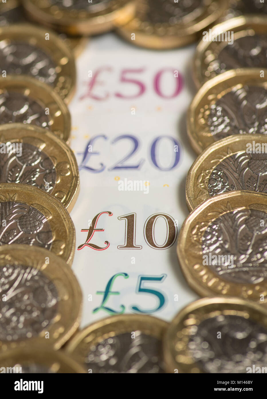 UK five pound, ten pound, twenty pound and fifty pound notes with one ...