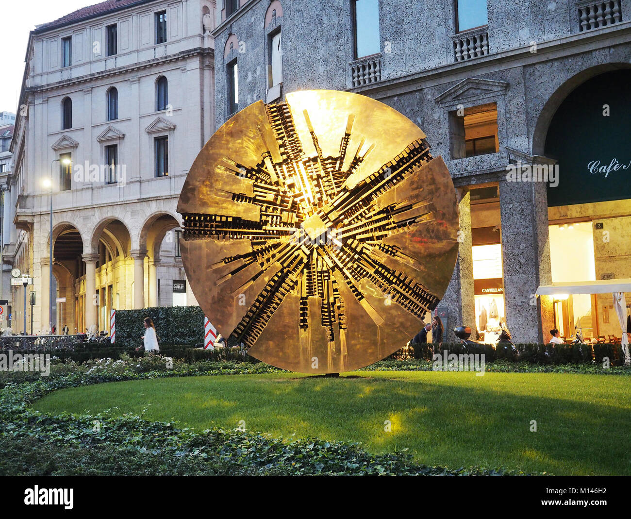 Europe,Italy,Lombardy,Milan,Arnoldo Pomodoro bronze disc sculpture in ...