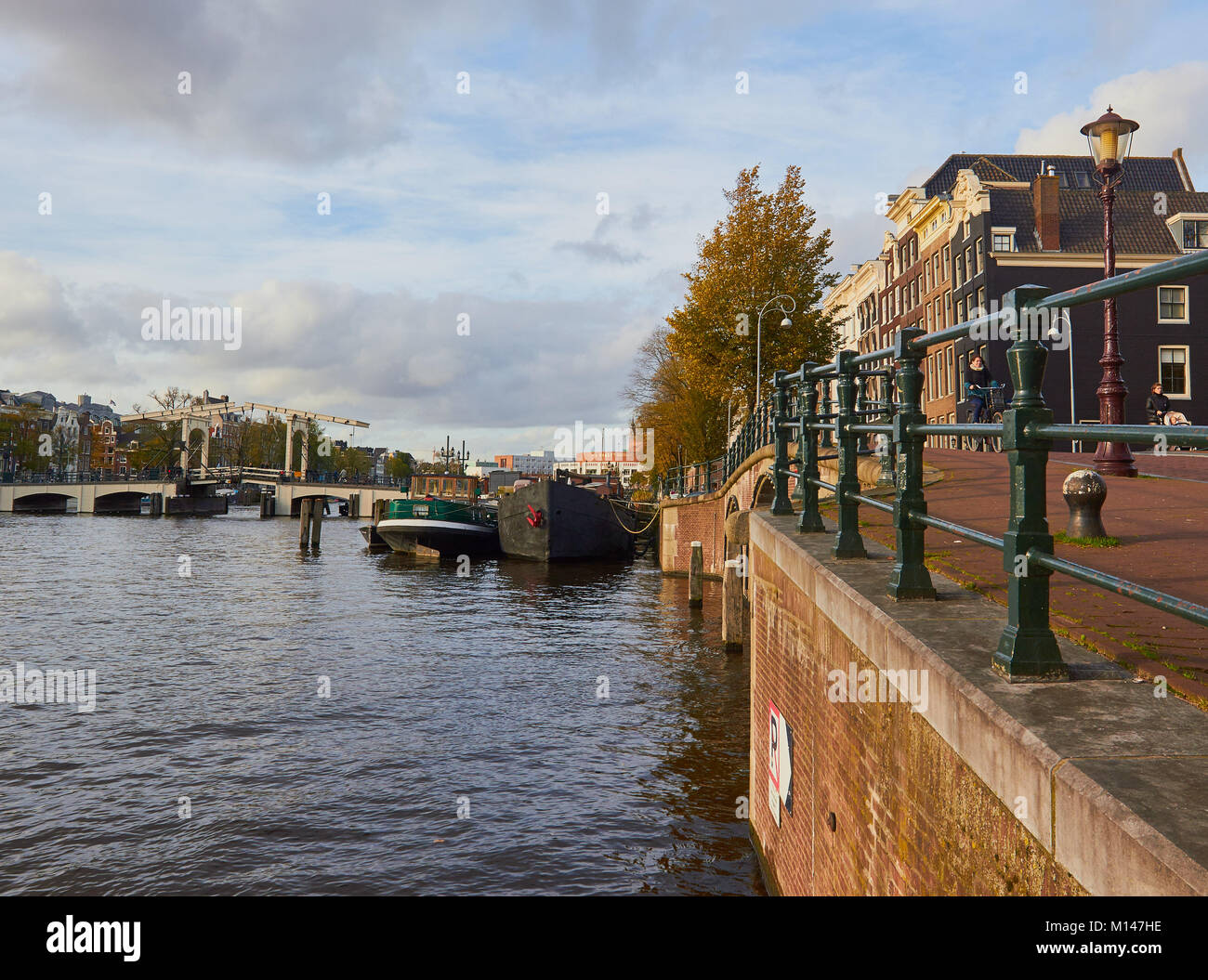 View along the Amstel river towards Magere Brug (skinny bridge) a ...