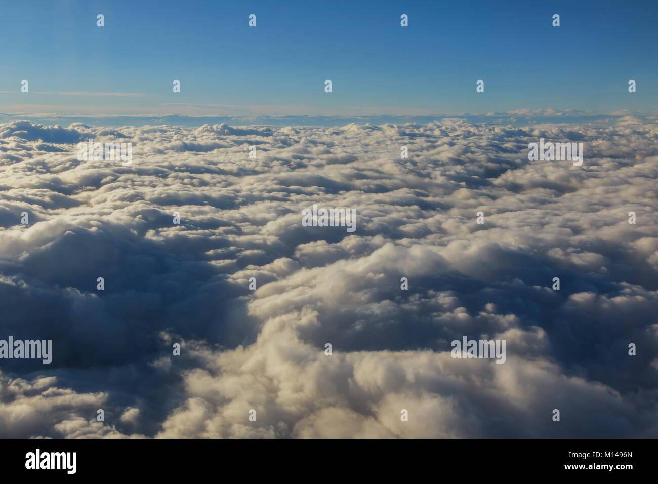 flying above the clouds. view from the airplane Stock Photo - Alamy