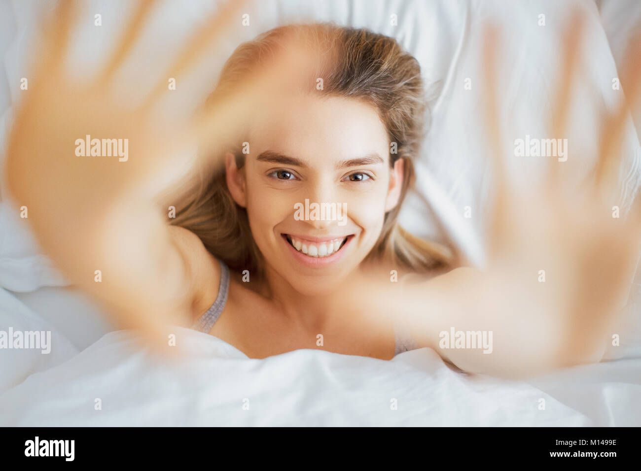 Pretty blonde woman in bed hi-res stock photography and images - Alamy