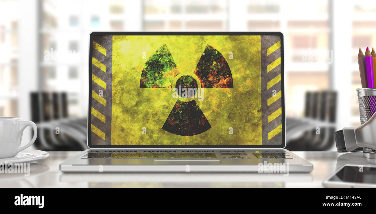 Radiation symbol on a laptop screen, blur office background. 3d ...