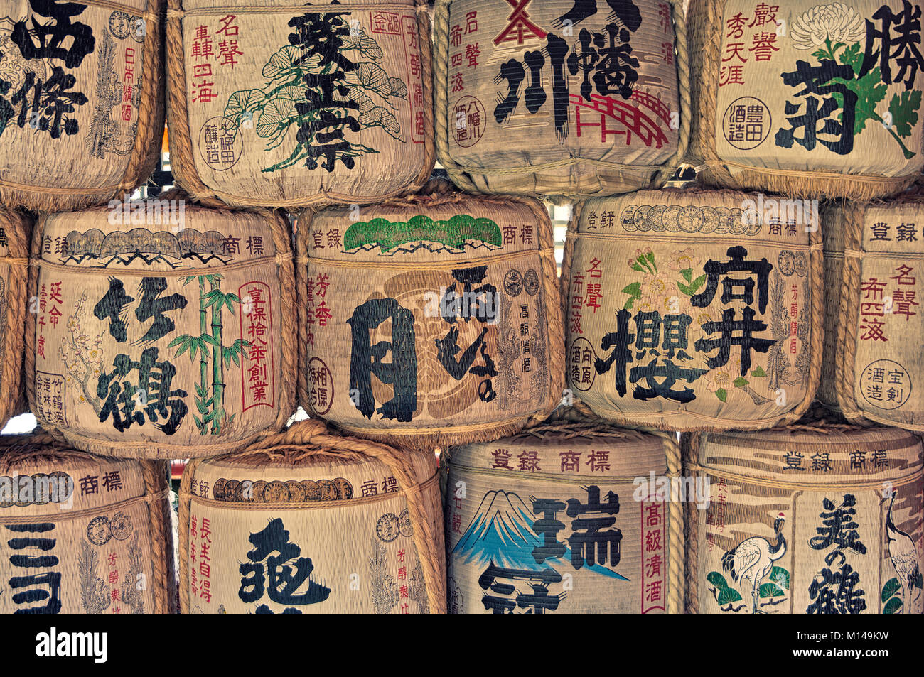 A wall of painted japan casks stacked up forming three rows Stock Photo ...
