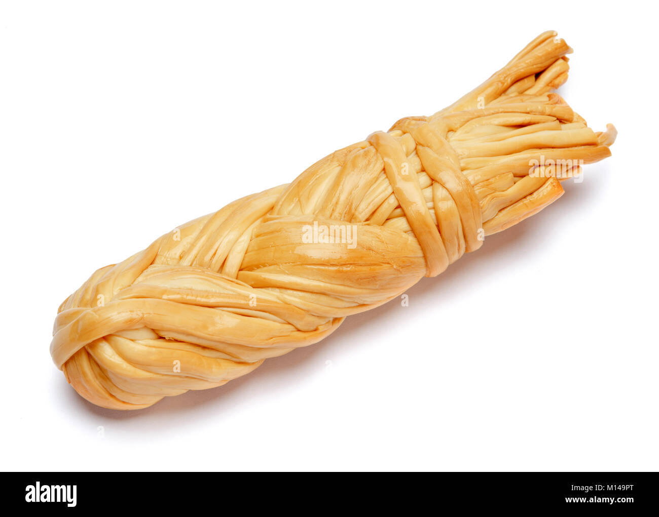 Smoked braided cheese isolated on white background Stock Photo - Alamy