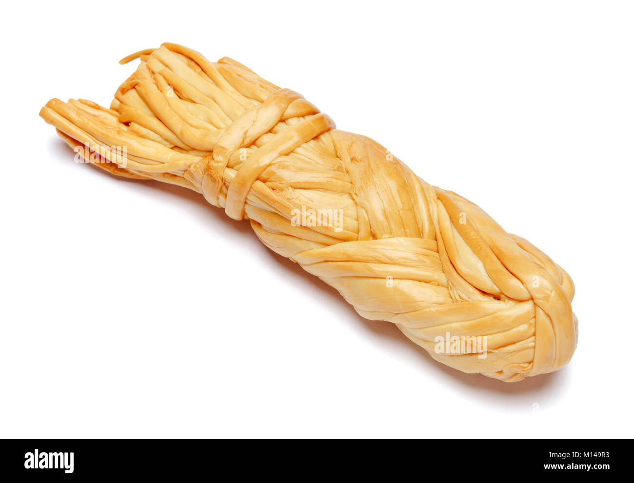 Smoked braided cheese isolated on white background Stock Photo - Alamy