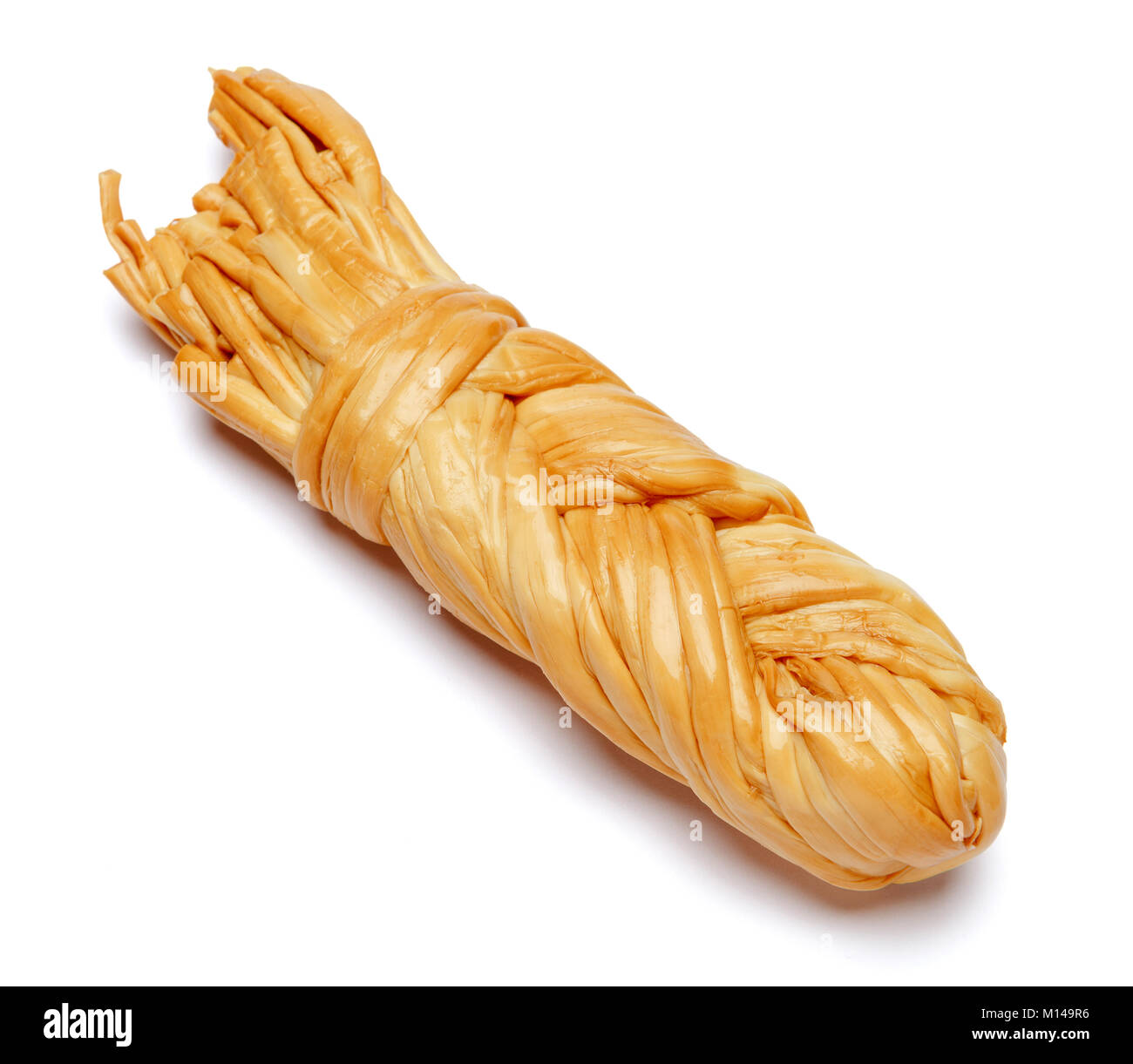 Smoked braided cheese isolated on white background Stock Photo - Alamy