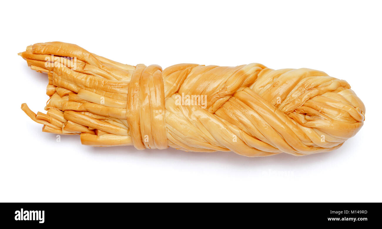 Smoked braided cheese isolated on white background Stock Photo - Alamy
