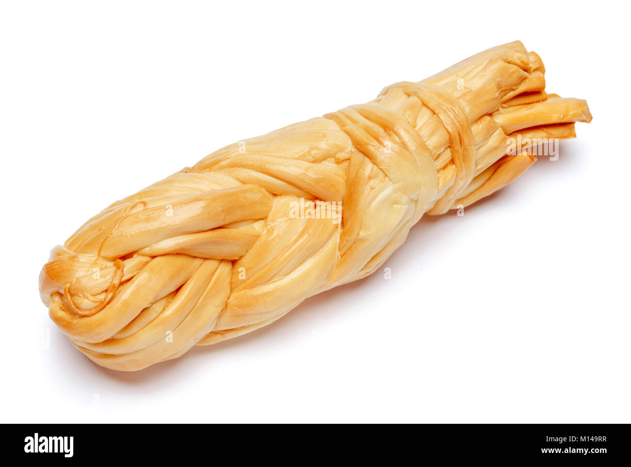 Smoked braided cheese isolated on white background Stock Photo - Alamy
