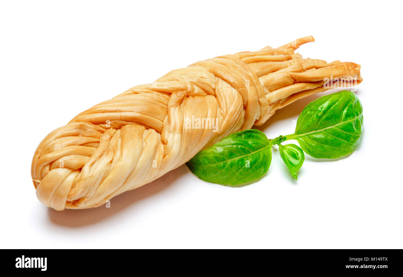 Smoked braided cheese isolated on white background Stock Photo - Alamy