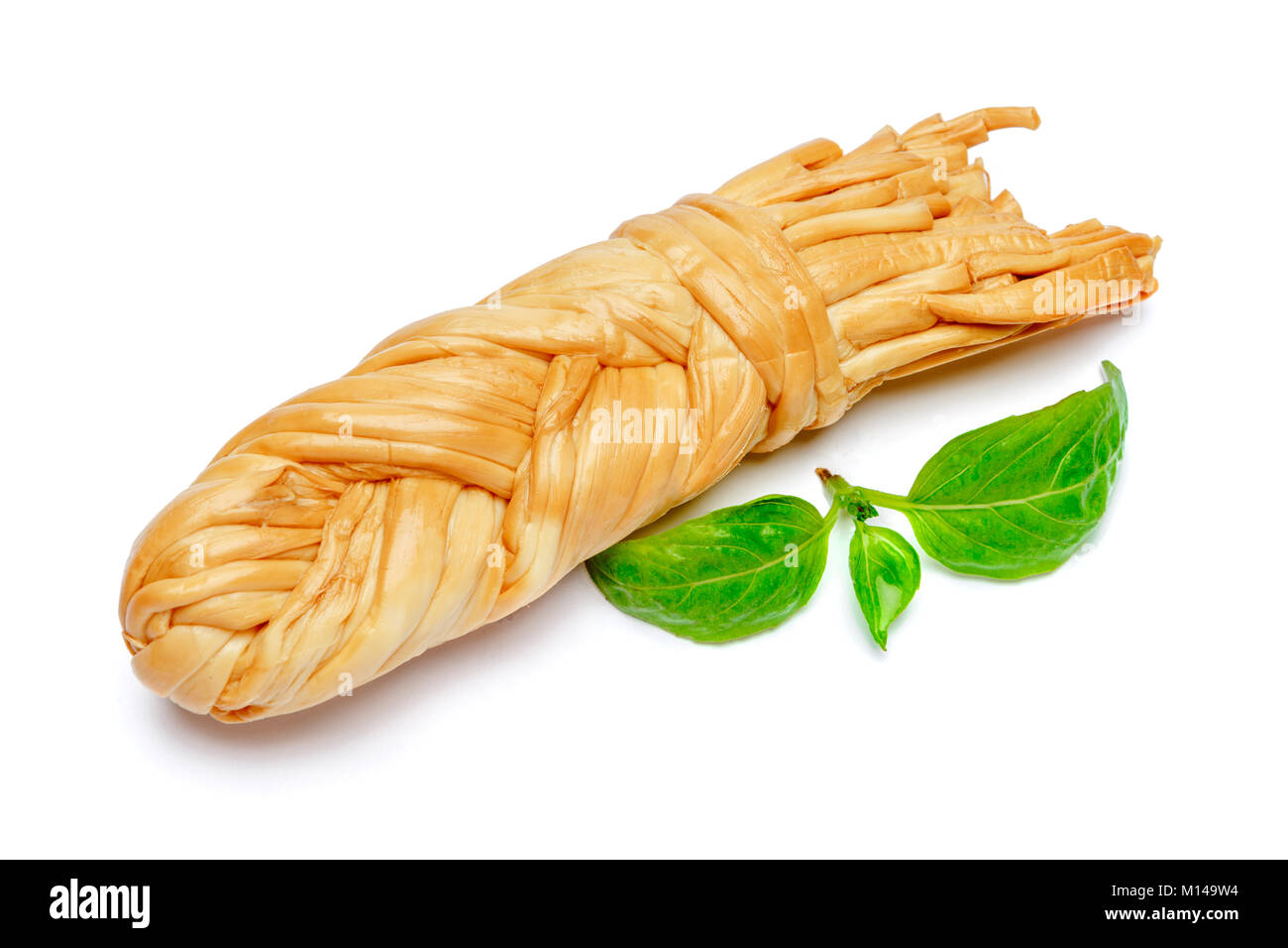 Smoked braided cheese isolated on white background Stock Photo - Alamy