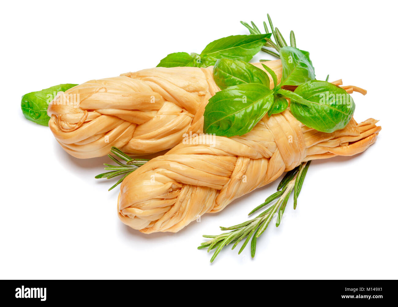 Smoked braided cheese isolated on white background Stock Photo - Alamy