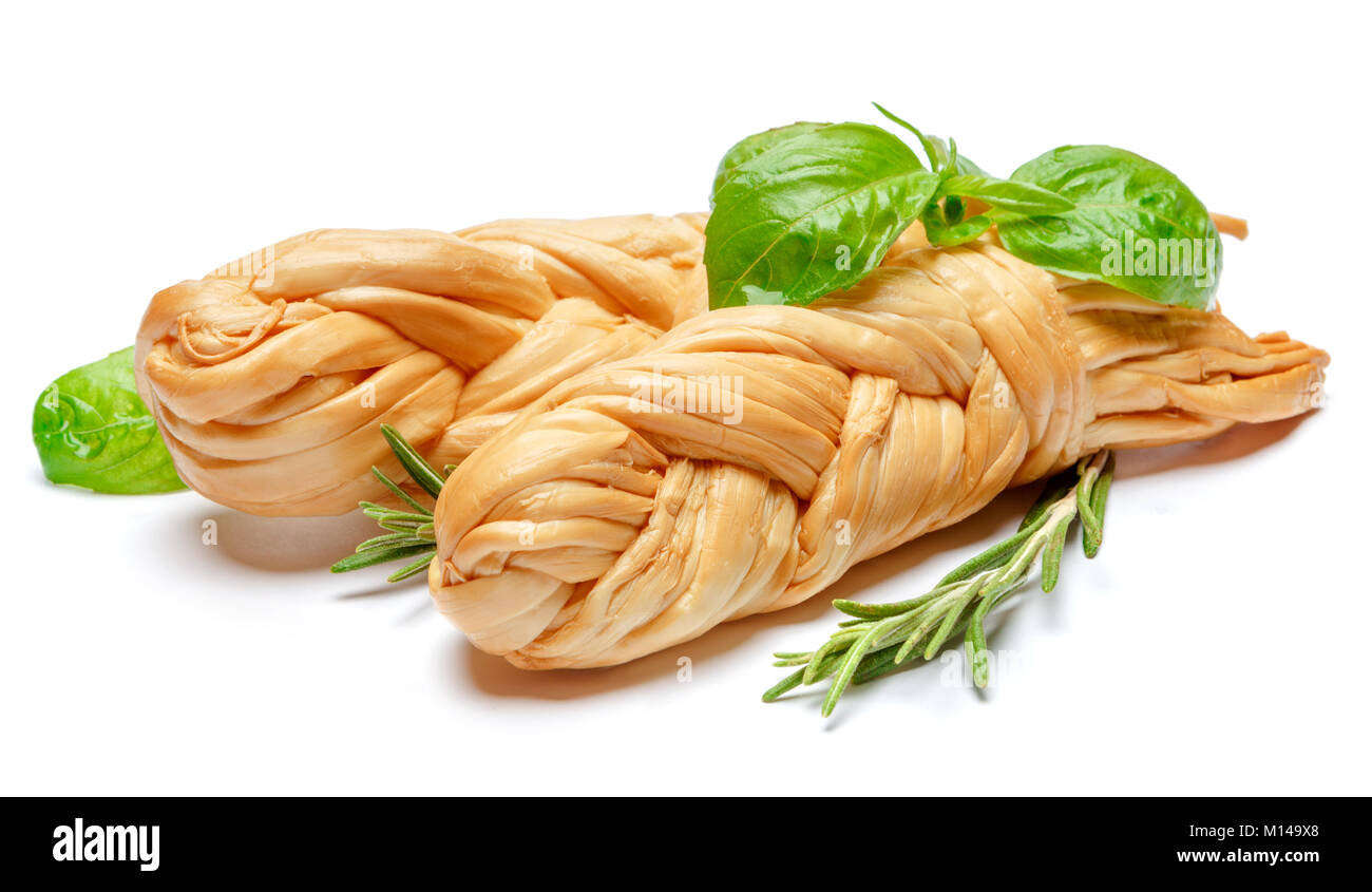 Smoked braided cheese isolated on white background Stock Photo - Alamy