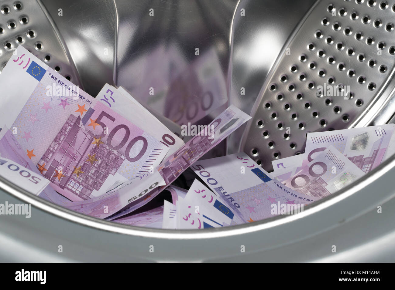 Financial crisis. Money laundering: money in the washing machine Stock ...