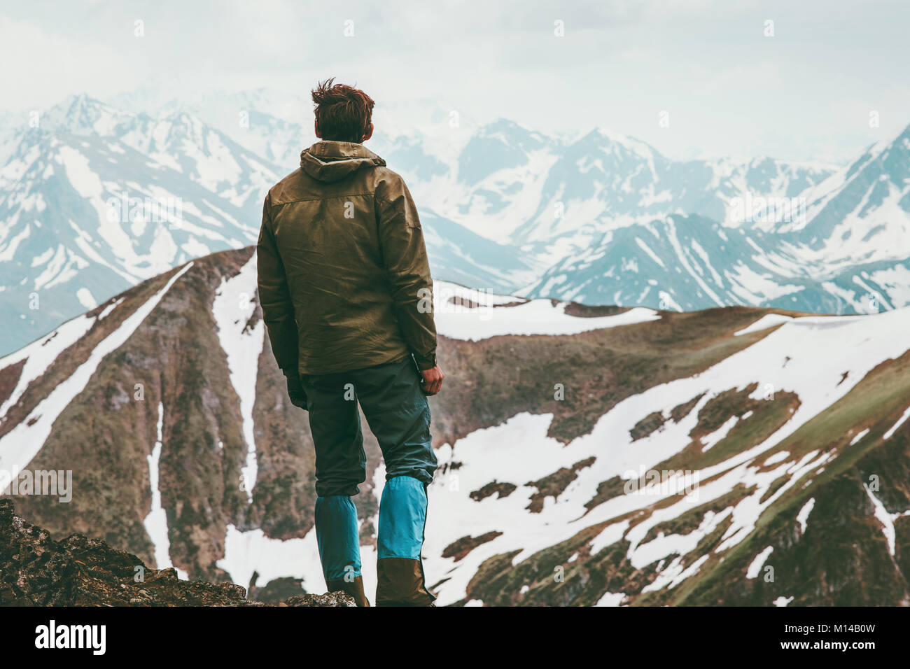 Climber Man reached mountain summit Travel Lifestyle concept traveler ...