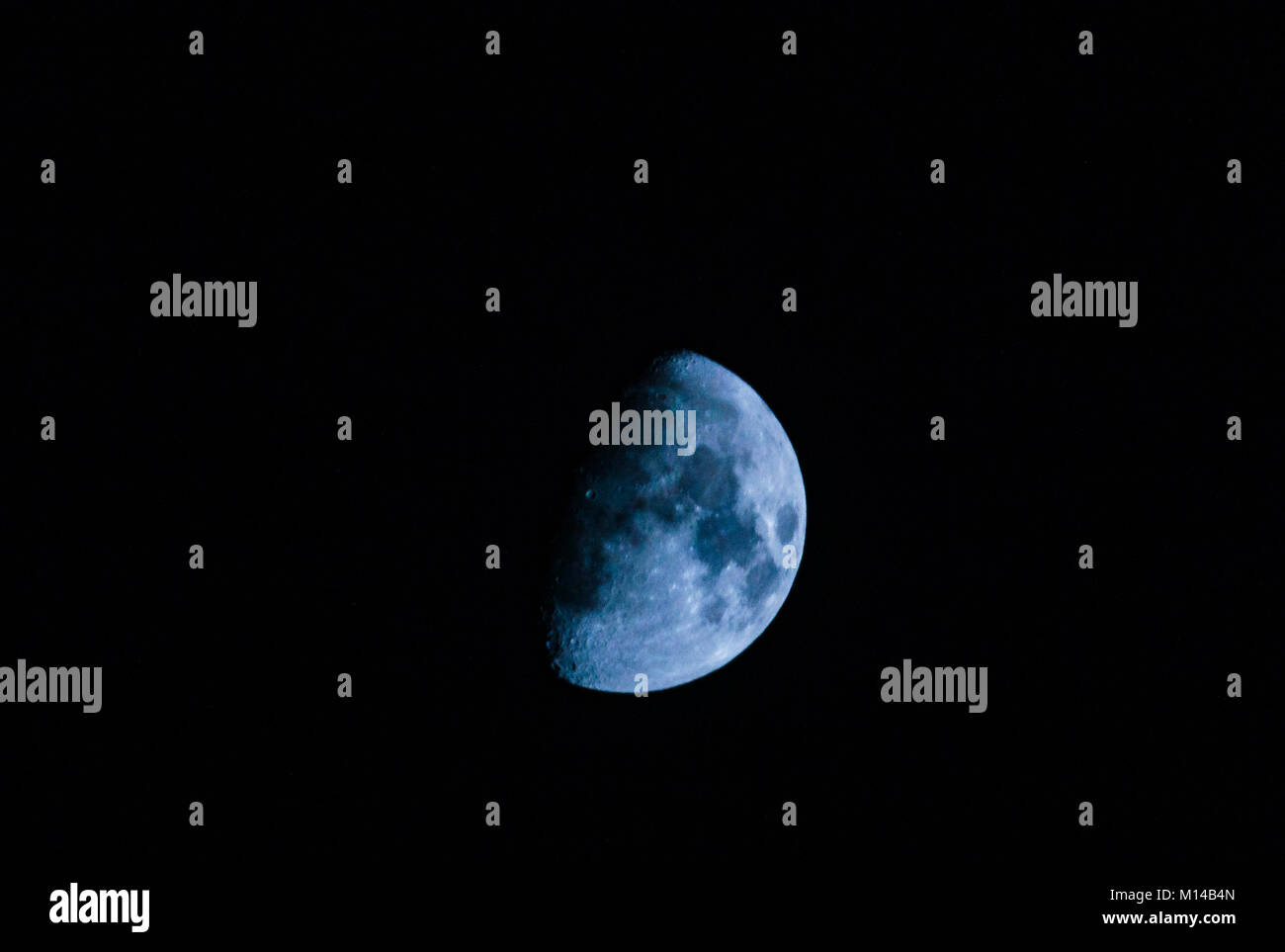 half blue moon black sky night photography Stock Photo - Alamy