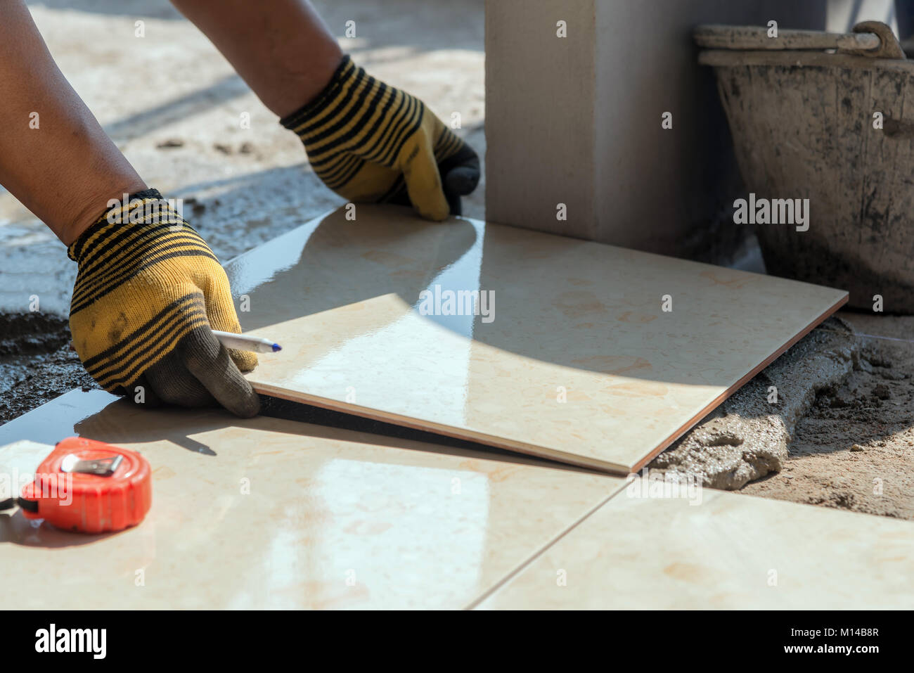 Installing tiles hi-res stock photography and images - Alamy