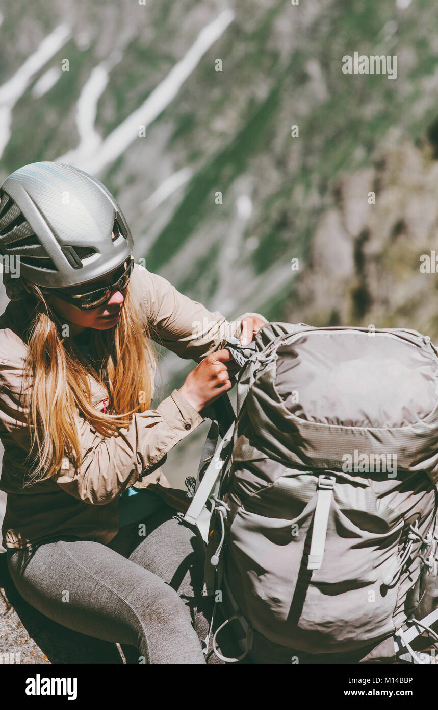 Woman climber with backpack in mountains Travel Lifestyle adventure ...