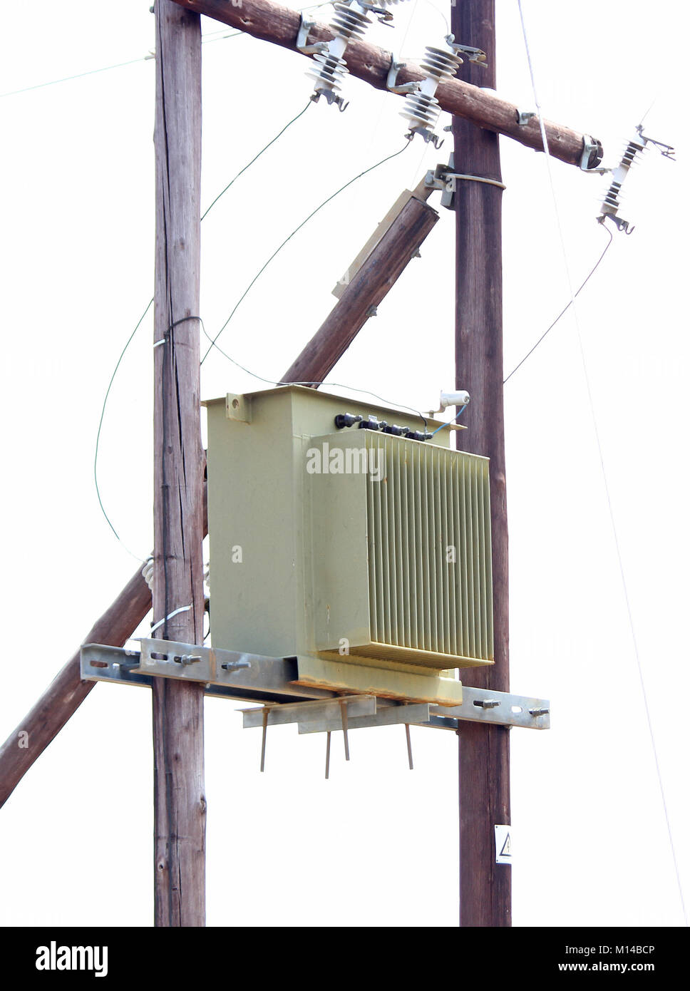 Wooden electricity pylon with transformer against cloudy sky, at Zebula ...