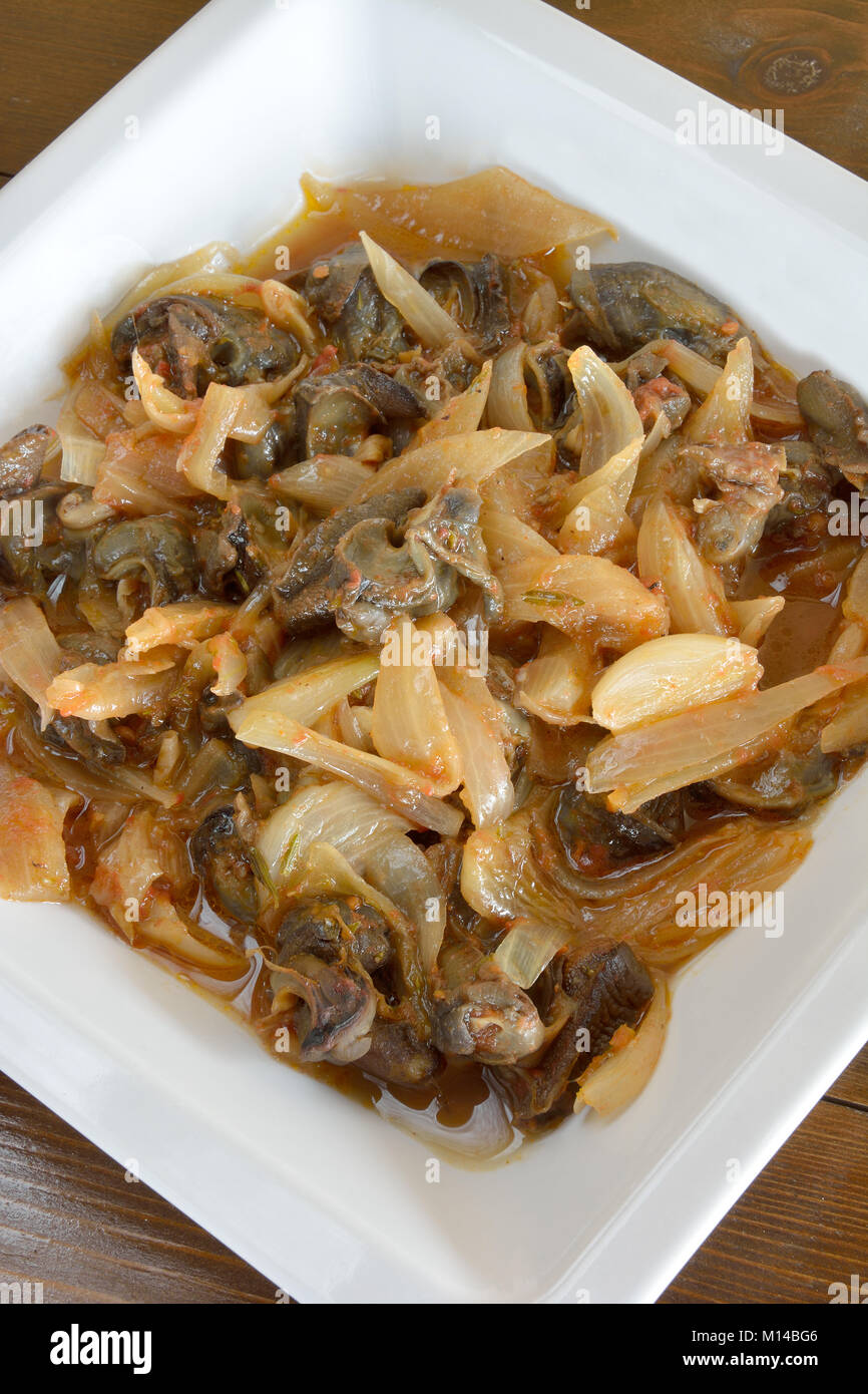 Stew of snail in a plate Stock Photo - Alamy