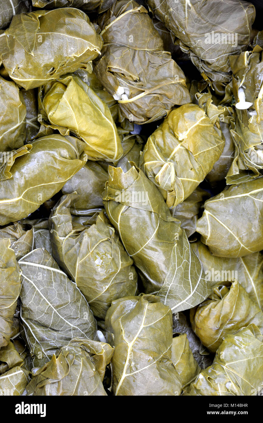 Stuffed grape leaves with rice , dolmadakia as background Stock Photo ...