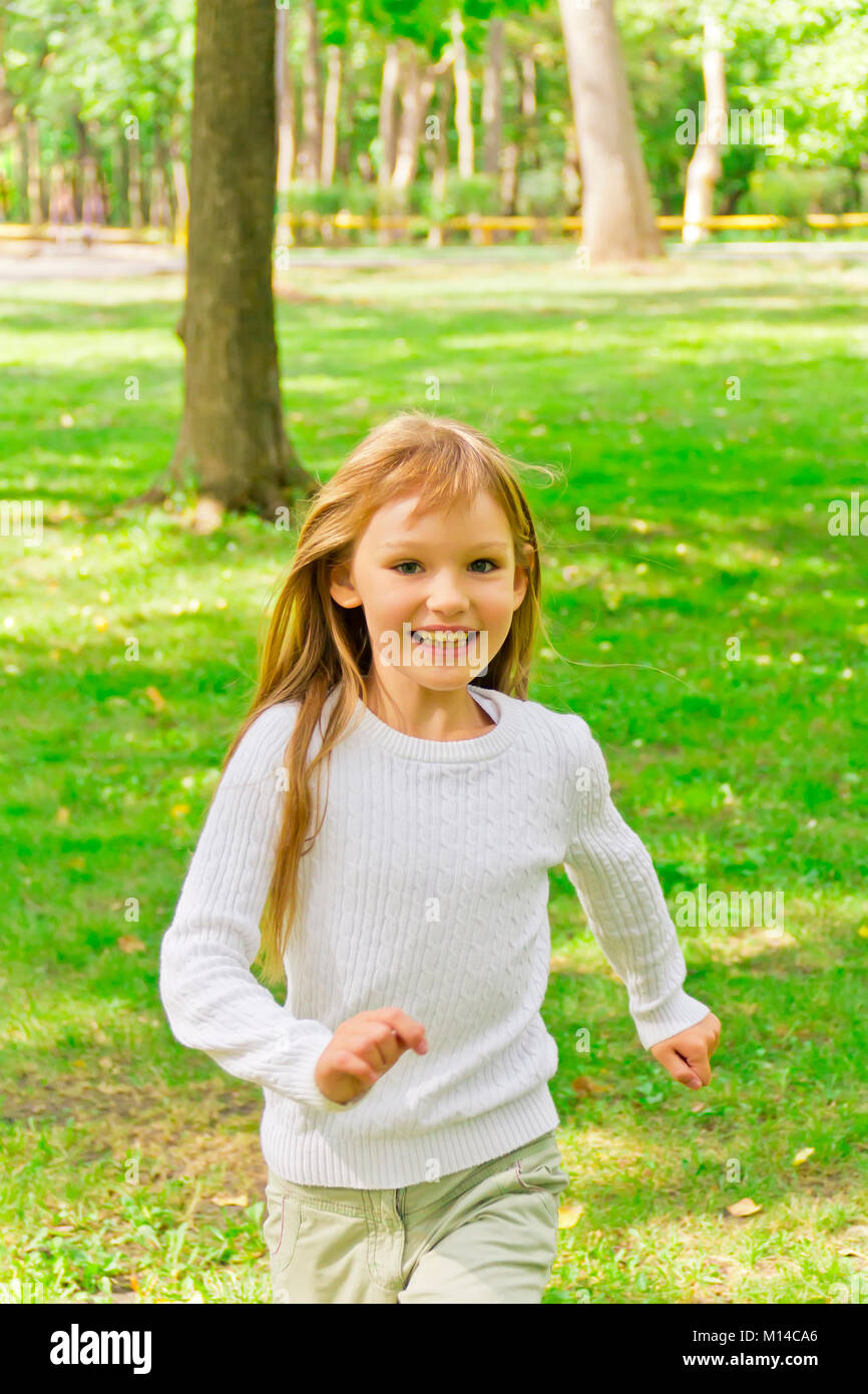 Photo of cute running girl in summer Stock Photo - Alamy