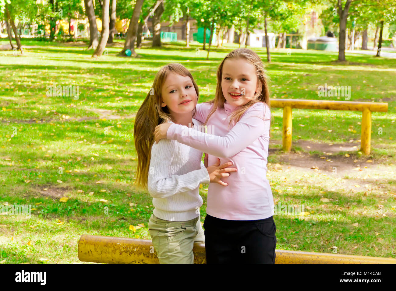 Photo of two playing girls in summer Stock Photo - Alamy