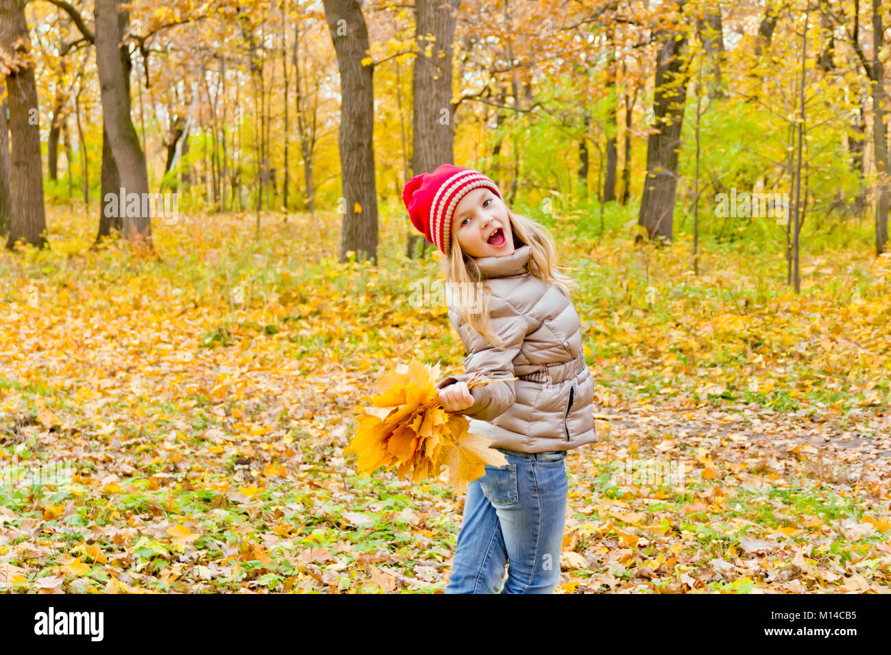 Photo of cute dancing girl in autumn Stock Photo - Alamy