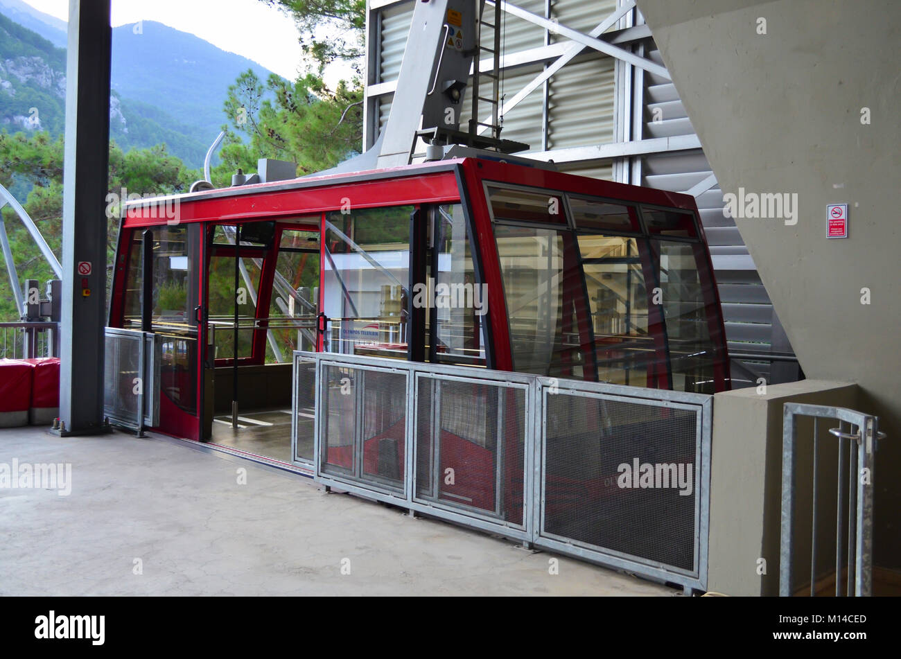 Open, empty cable car at a lower station waiting for it's passengers to ...
