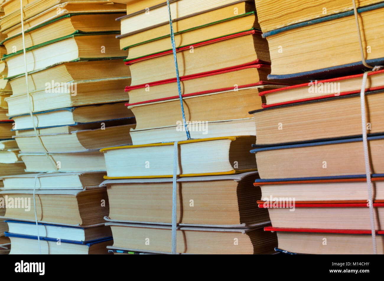 A colorful wall of tied books Stock Photo - Alamy
