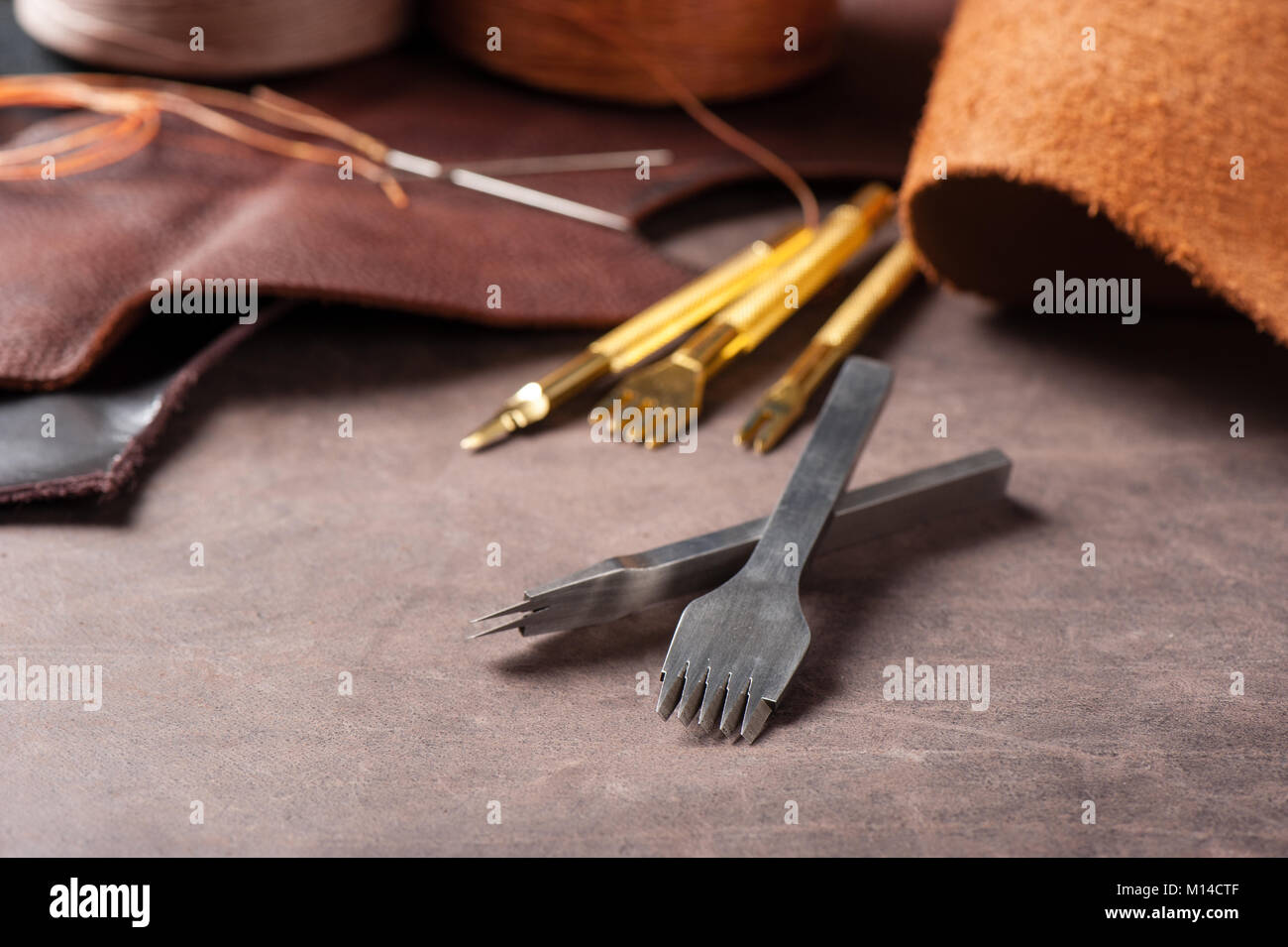The pricking irons for hand stitching leather Stock Photo - Alamy