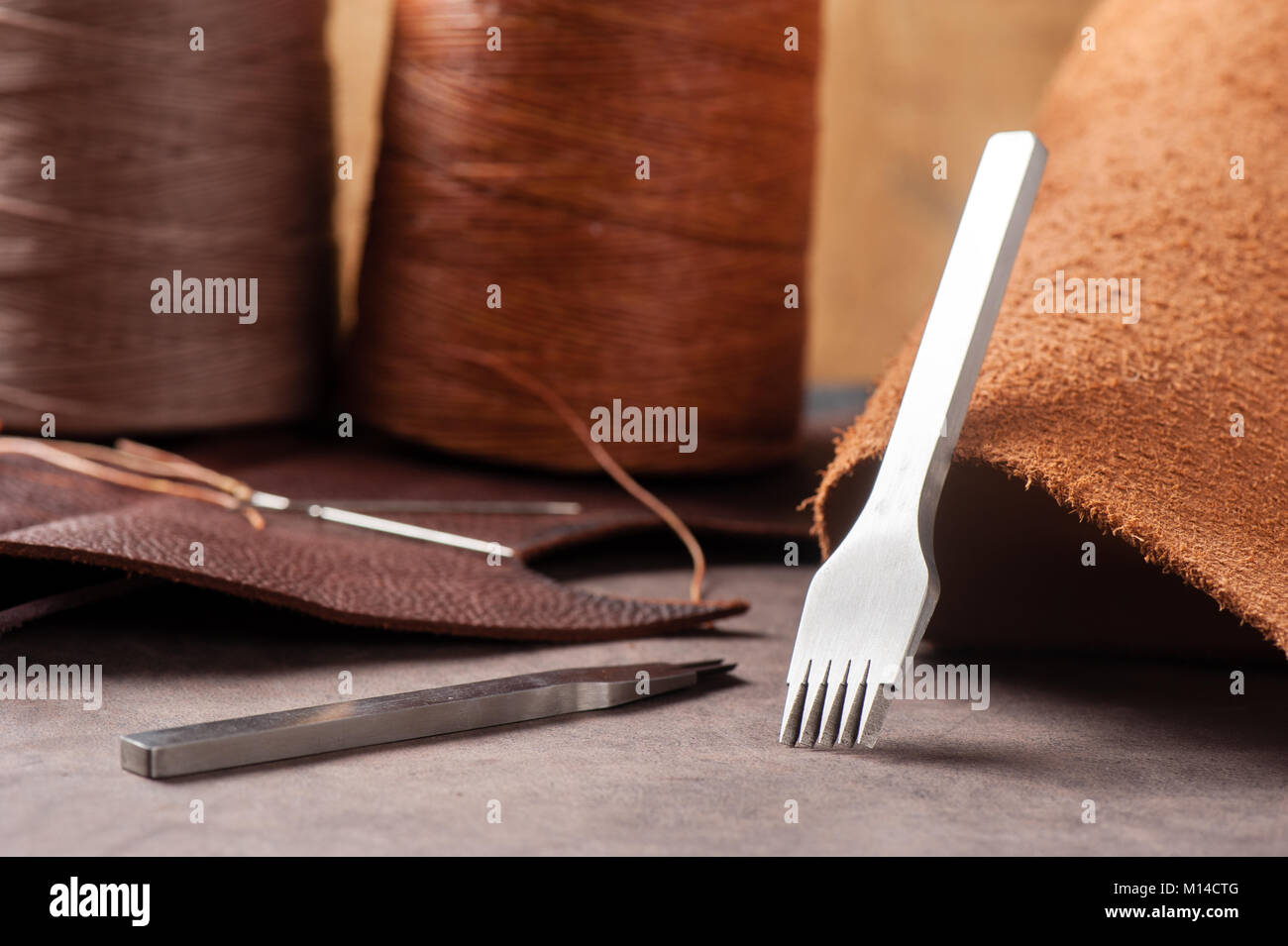 The pricking irons for hand stitching leather Stock Photo - Alamy