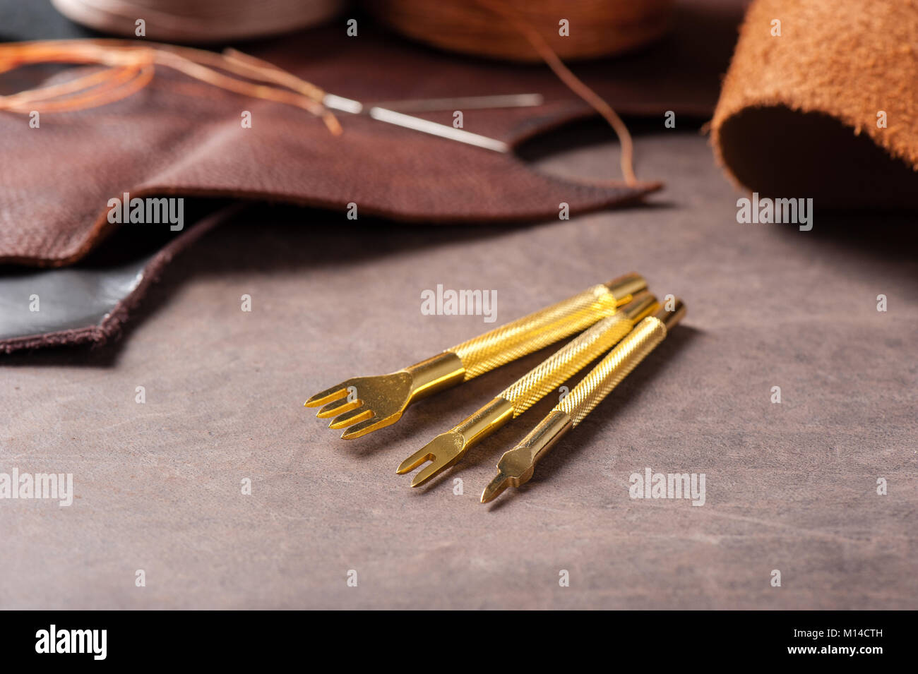 The pricking irons for hand stitching leather Stock Photo - Alamy