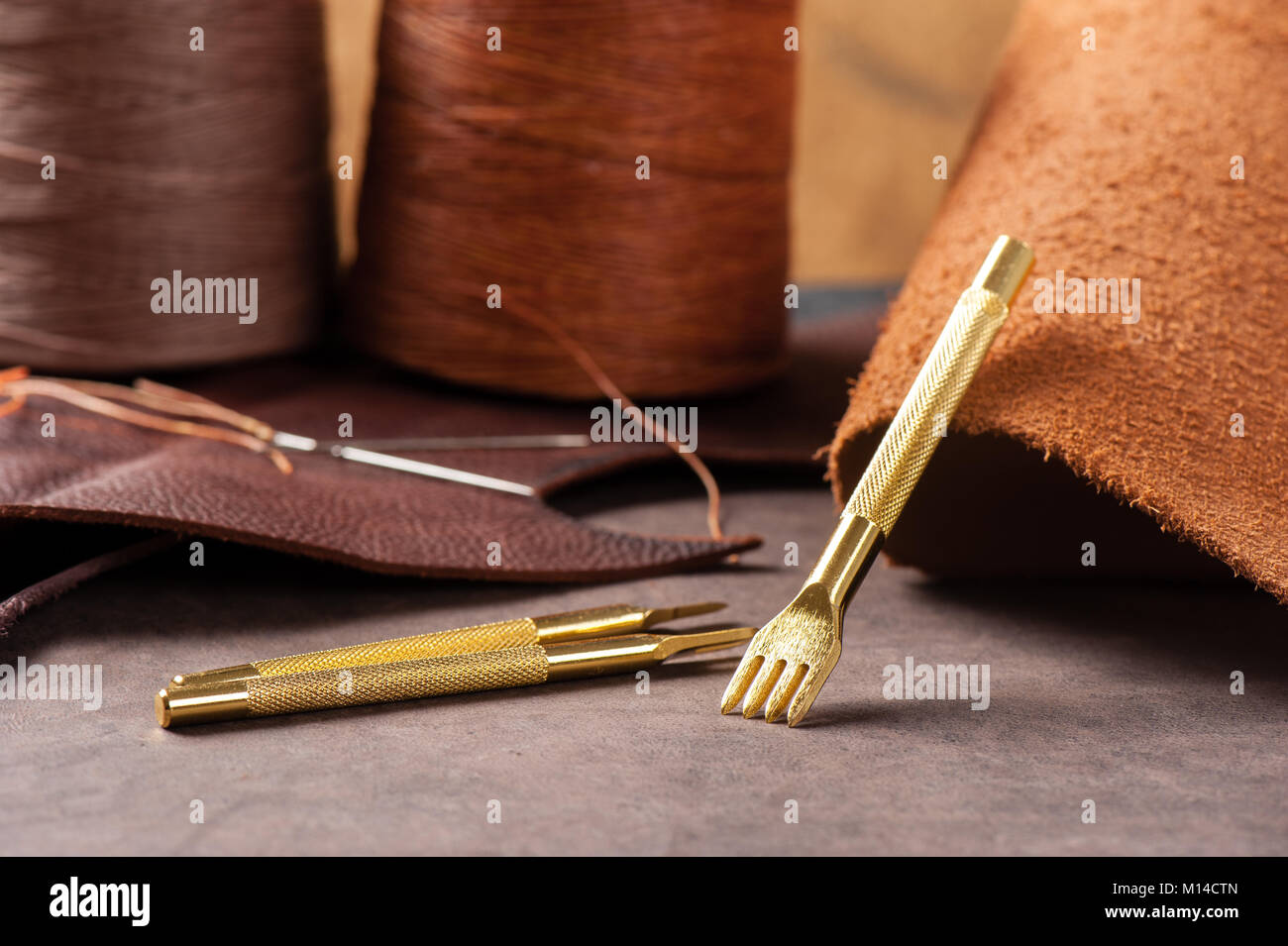 The pricking irons for hand stitching leather Stock Photo - Alamy