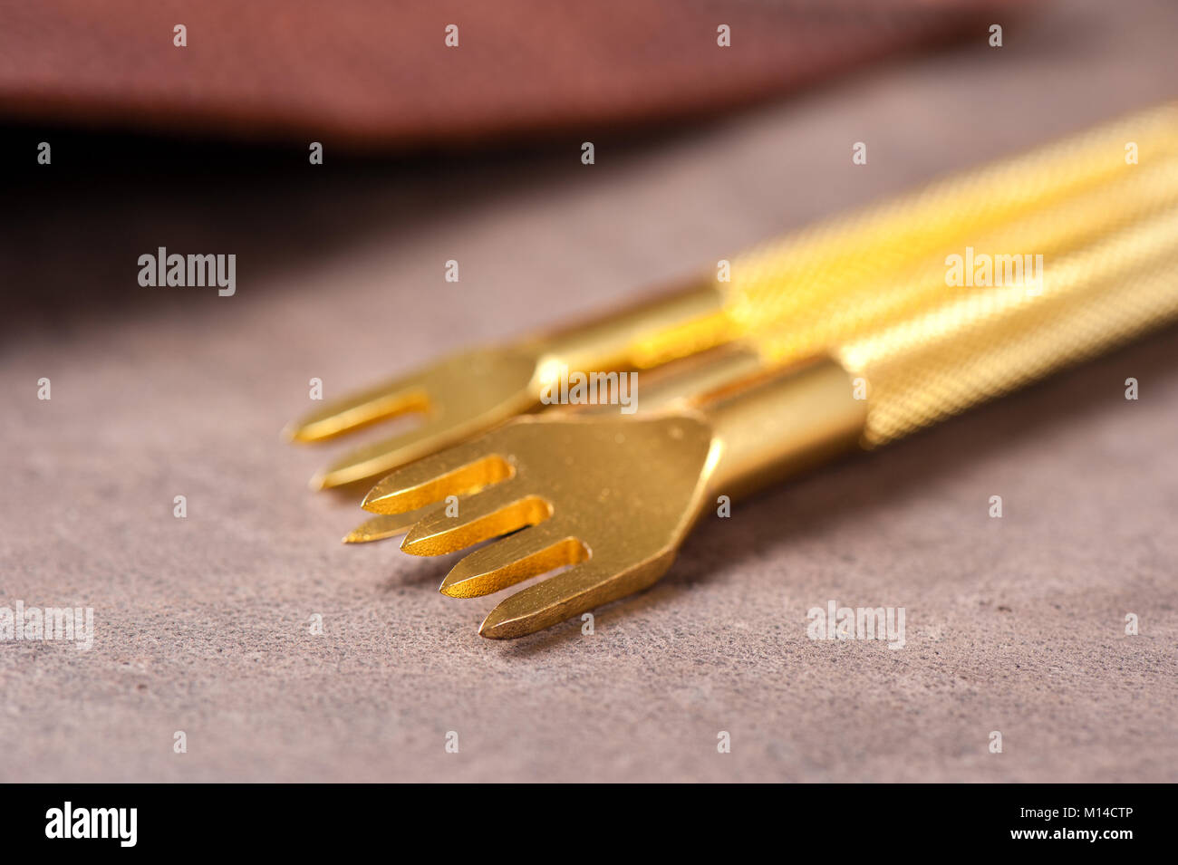 The pricking irons for hand stitching leather Stock Photo - Alamy