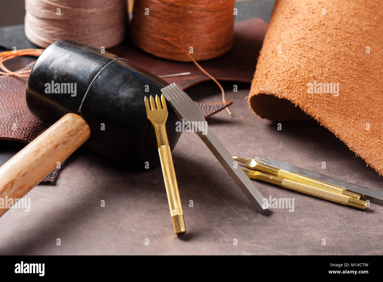 The pricking irons for hand stitching leather Stock Photo - Alamy