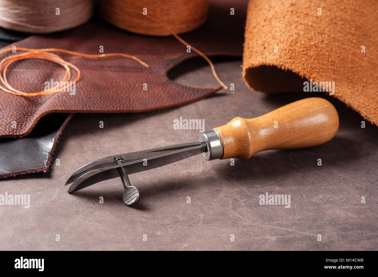 The adjustable double creaser for leather working Stock Photo - Alamy