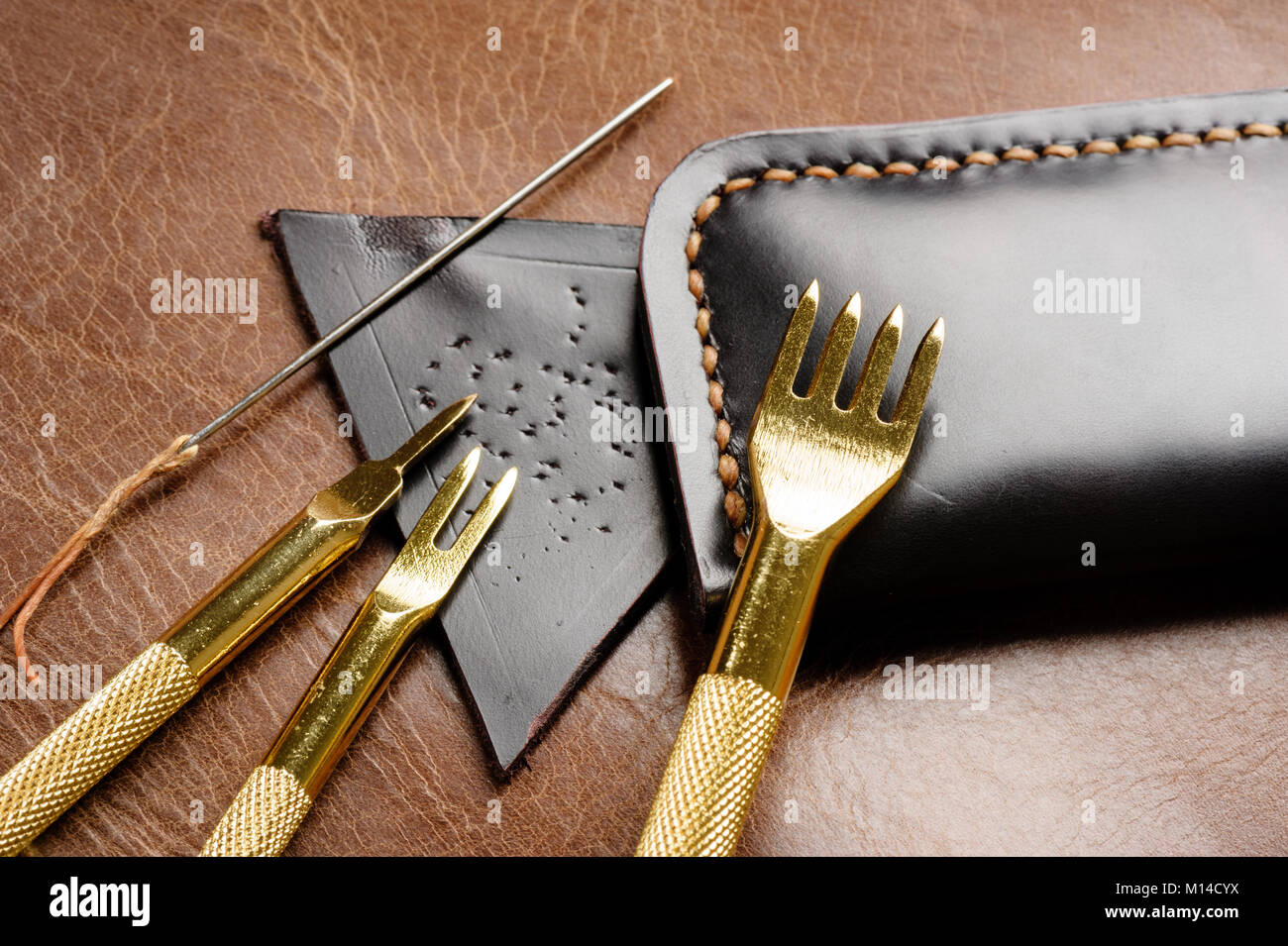 The pricking irons for hand stitching leather Stock Photo - Alamy