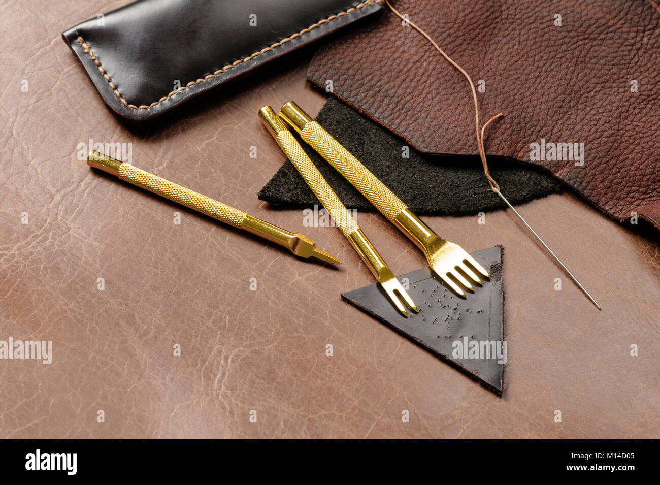 The pricking irons for hand stitching leather Stock Photo - Alamy