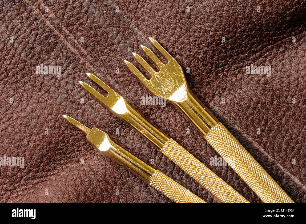 The pricking irons for hand stitching leather Stock Photo - Alamy