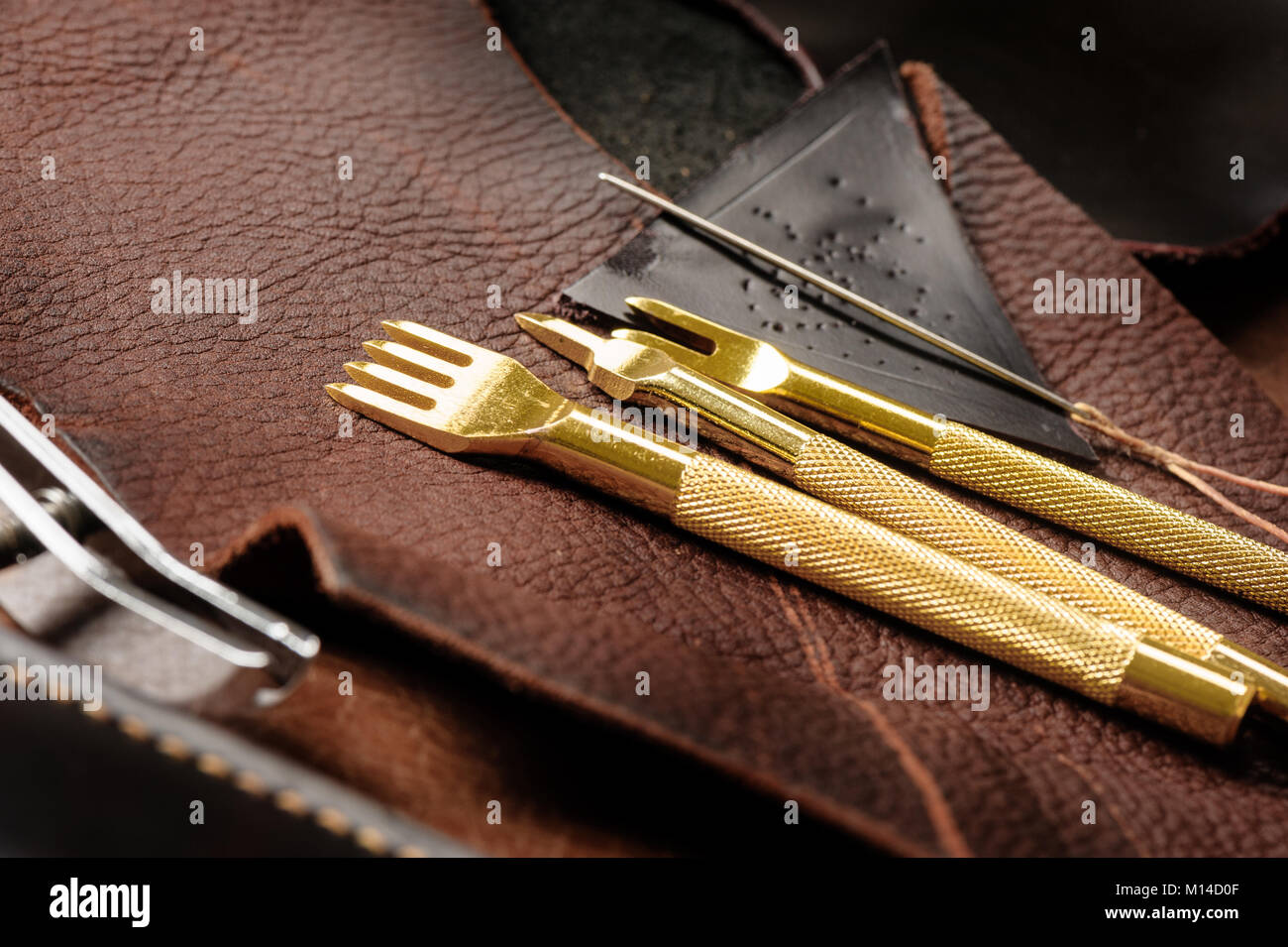 The pricking irons for hand stitching leather Stock Photo - Alamy