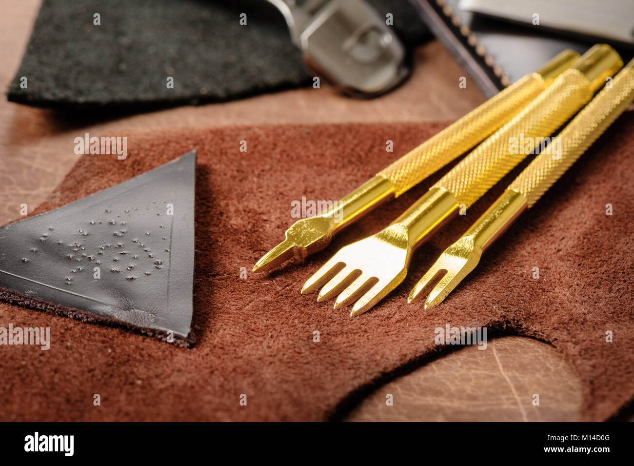 The pricking irons for hand stitching leather Stock Photo - Alamy
