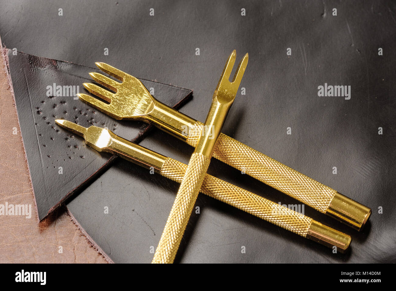 The pricking irons for hand stitching leather Stock Photo - Alamy