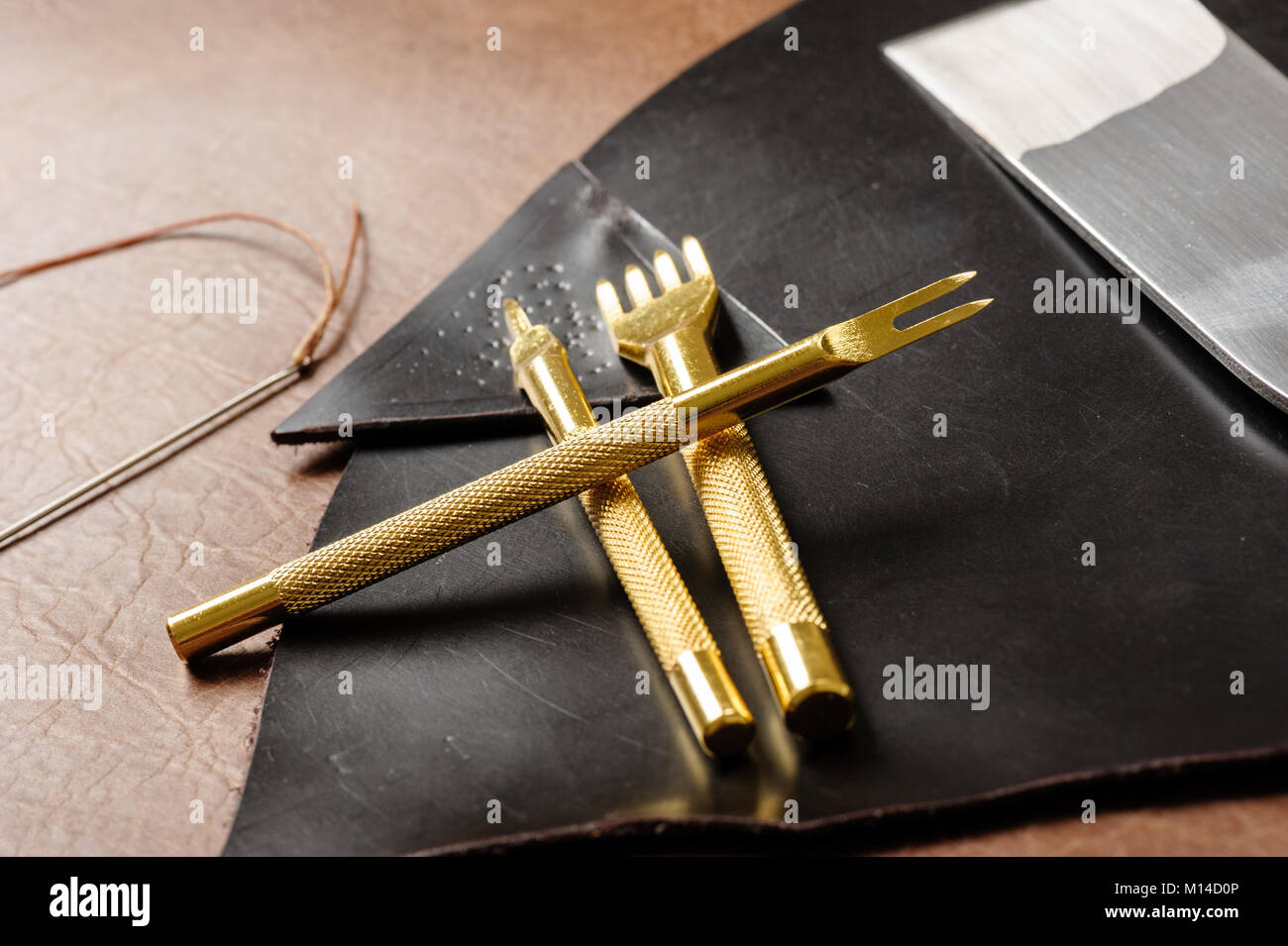The pricking irons for hand stitching leather Stock Photo - Alamy