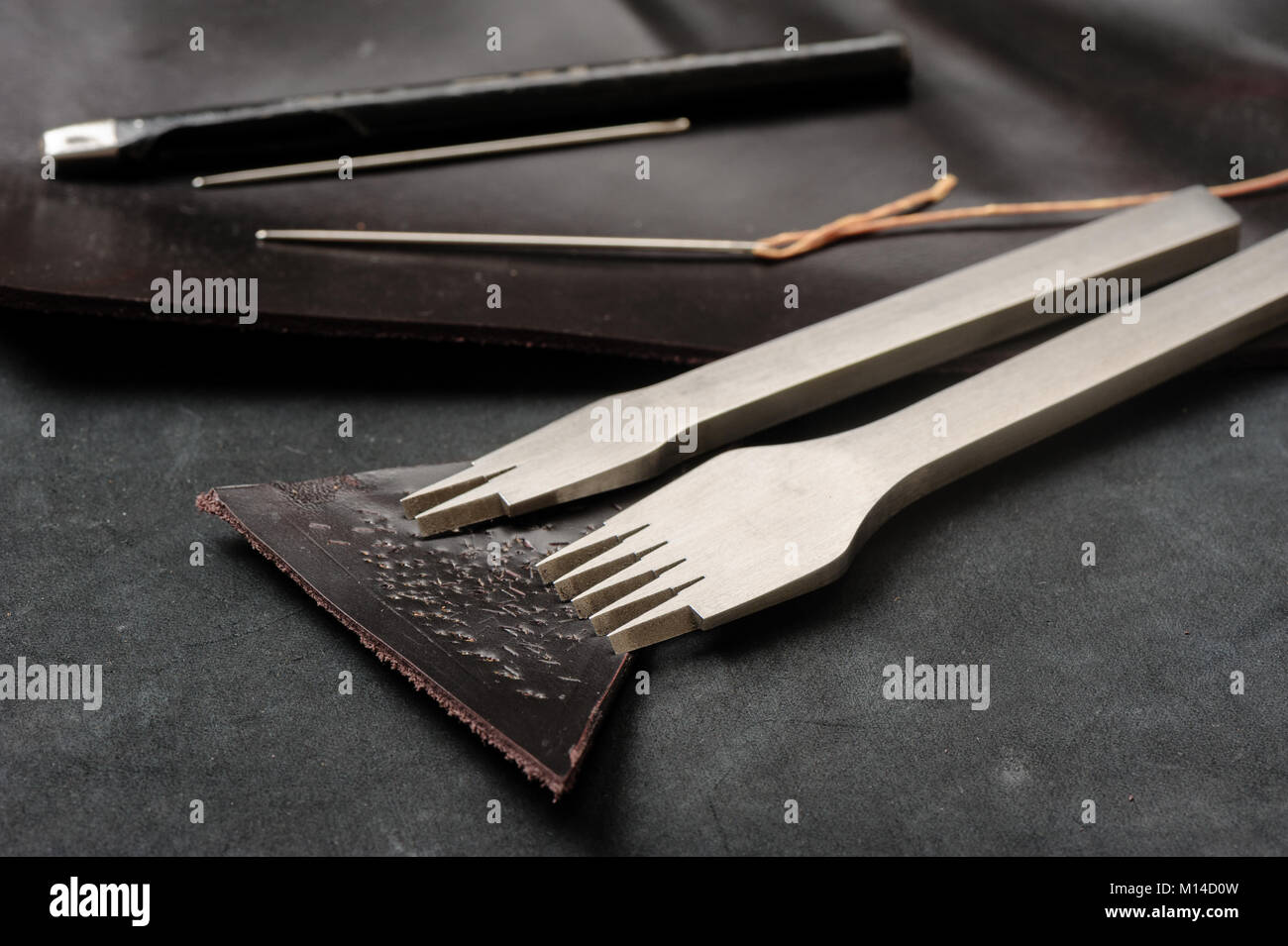The pricking irons for hand stitching leather Stock Photo - Alamy