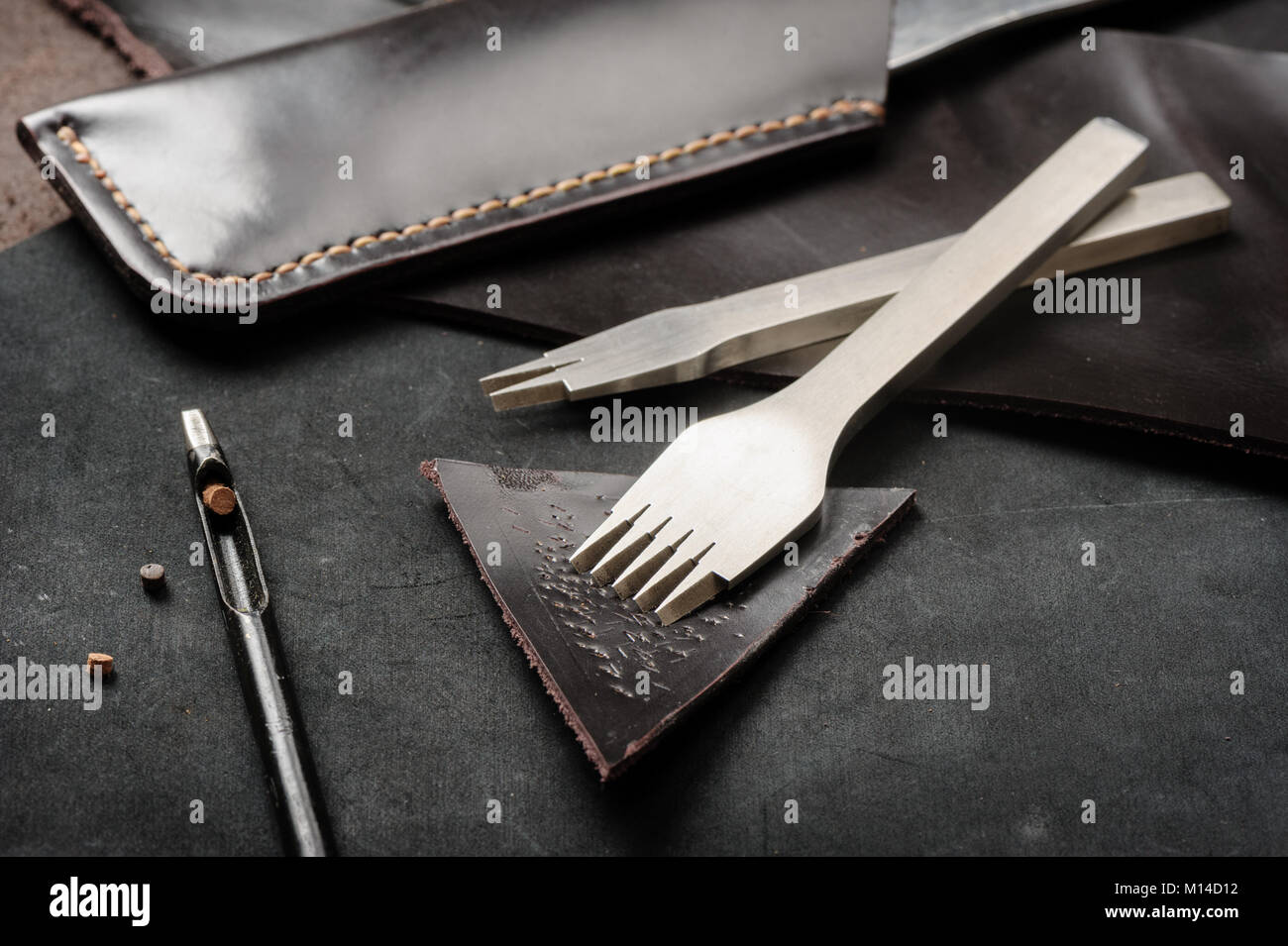 The pricking irons for hand stitching leather Stock Photo - Alamy