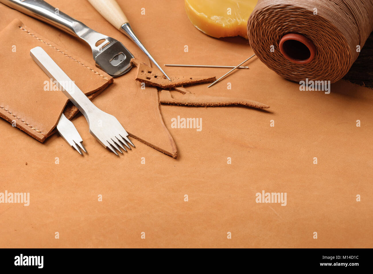 The pricking irons for hand stitching leather Stock Photo - Alamy