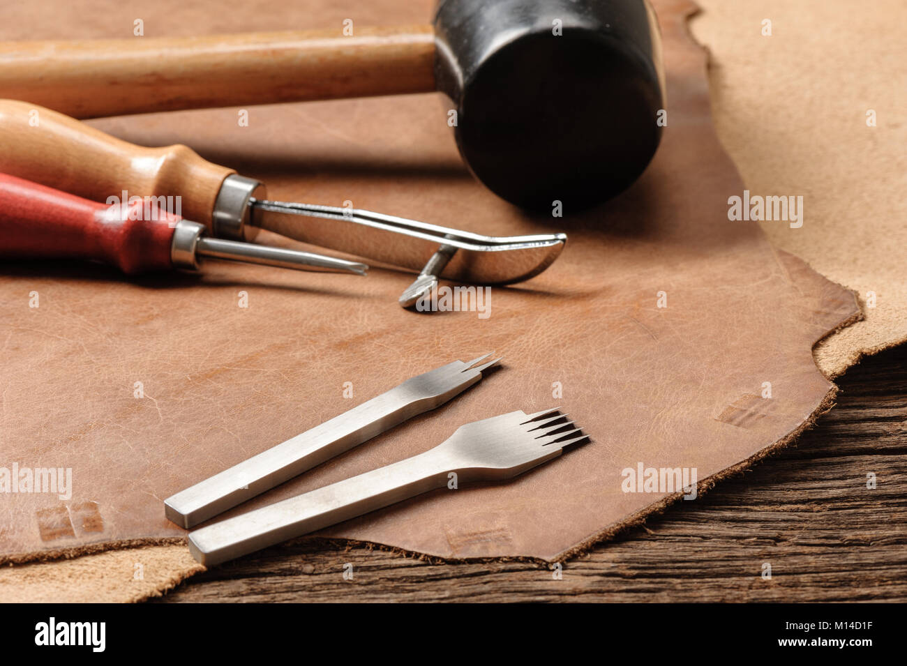 The pricking irons for hand stitching leather Stock Photo - Alamy