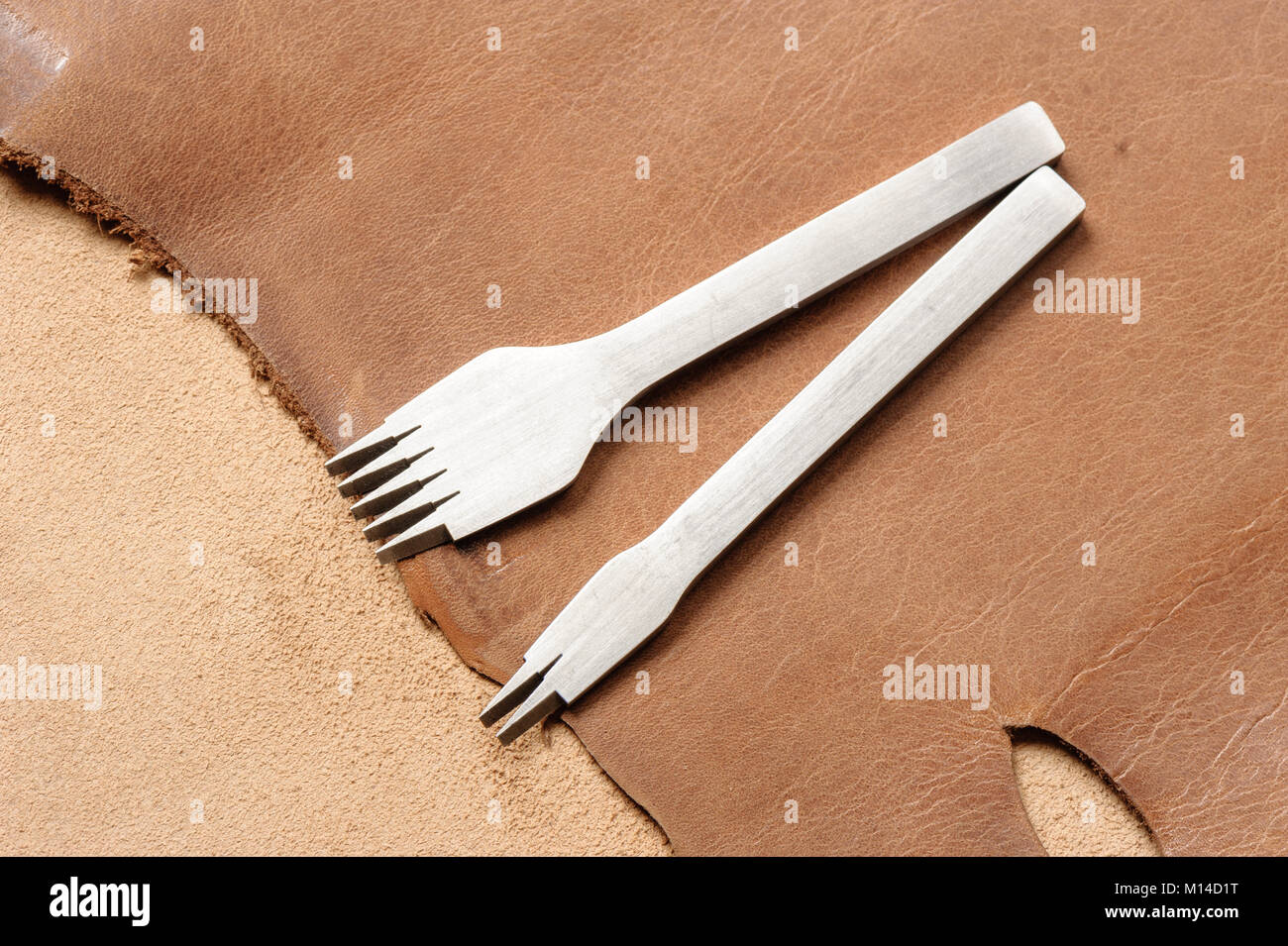 The pricking irons for hand stitching leather Stock Photo - Alamy
