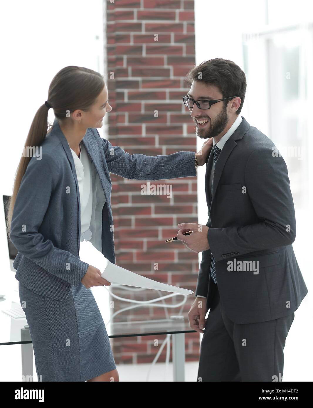 colleagues communicate with each other in a modern office Stock Photo ...