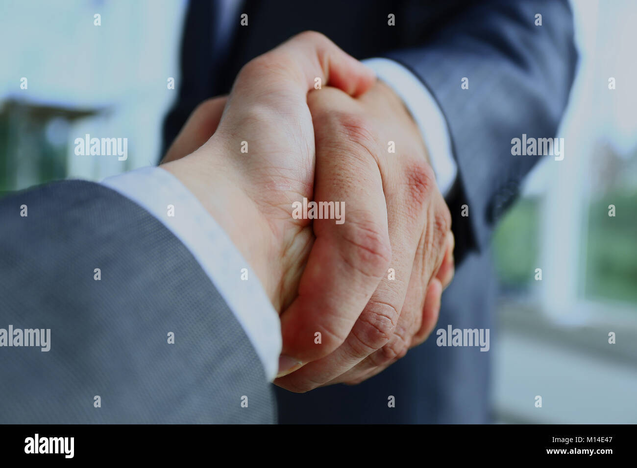 Closeup of a business handshake Stock Photo - Alamy